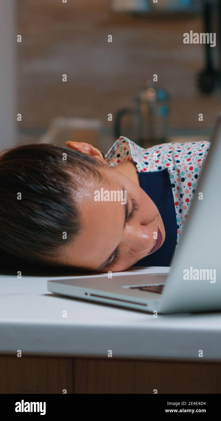 Exhausted overload business woman falling asleep on desk with open ...