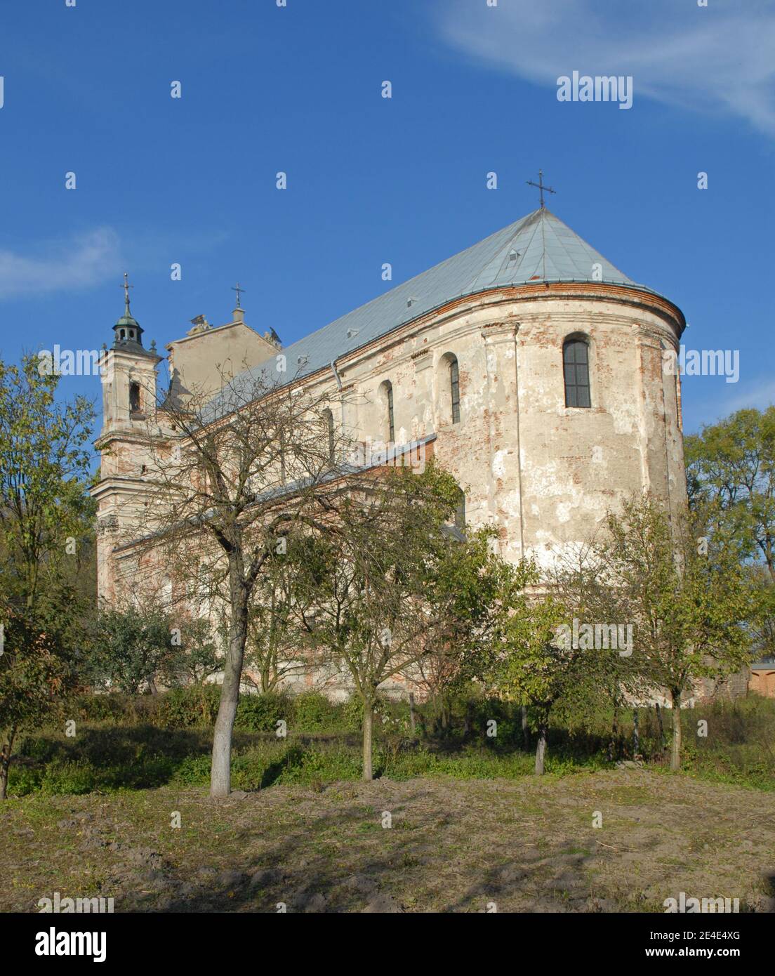 Old Colleagues cathedral against blue sky background. Olyka ...