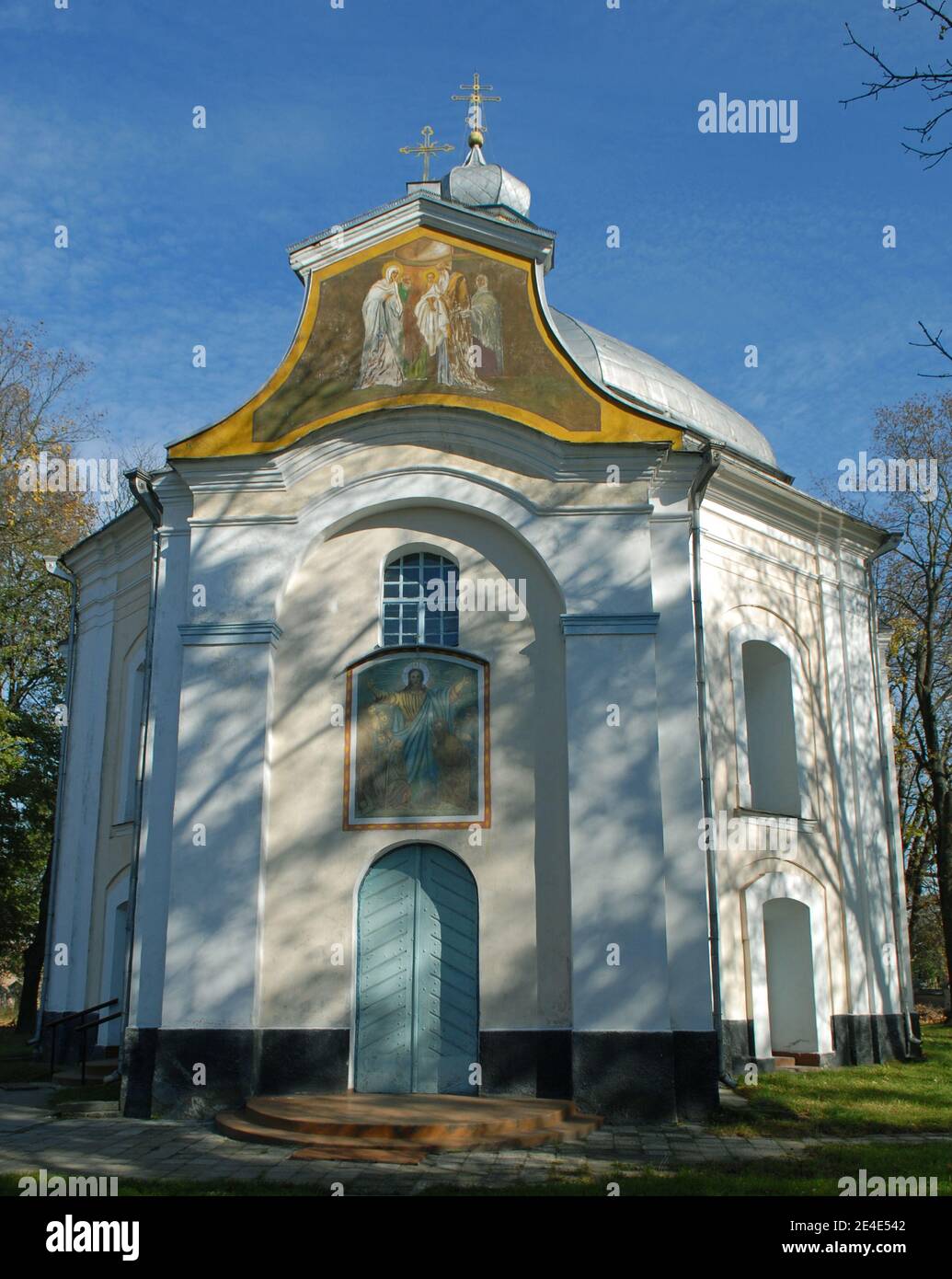 Facade of Candlemas (Candlemass) church against blue sky. Two paintings ...