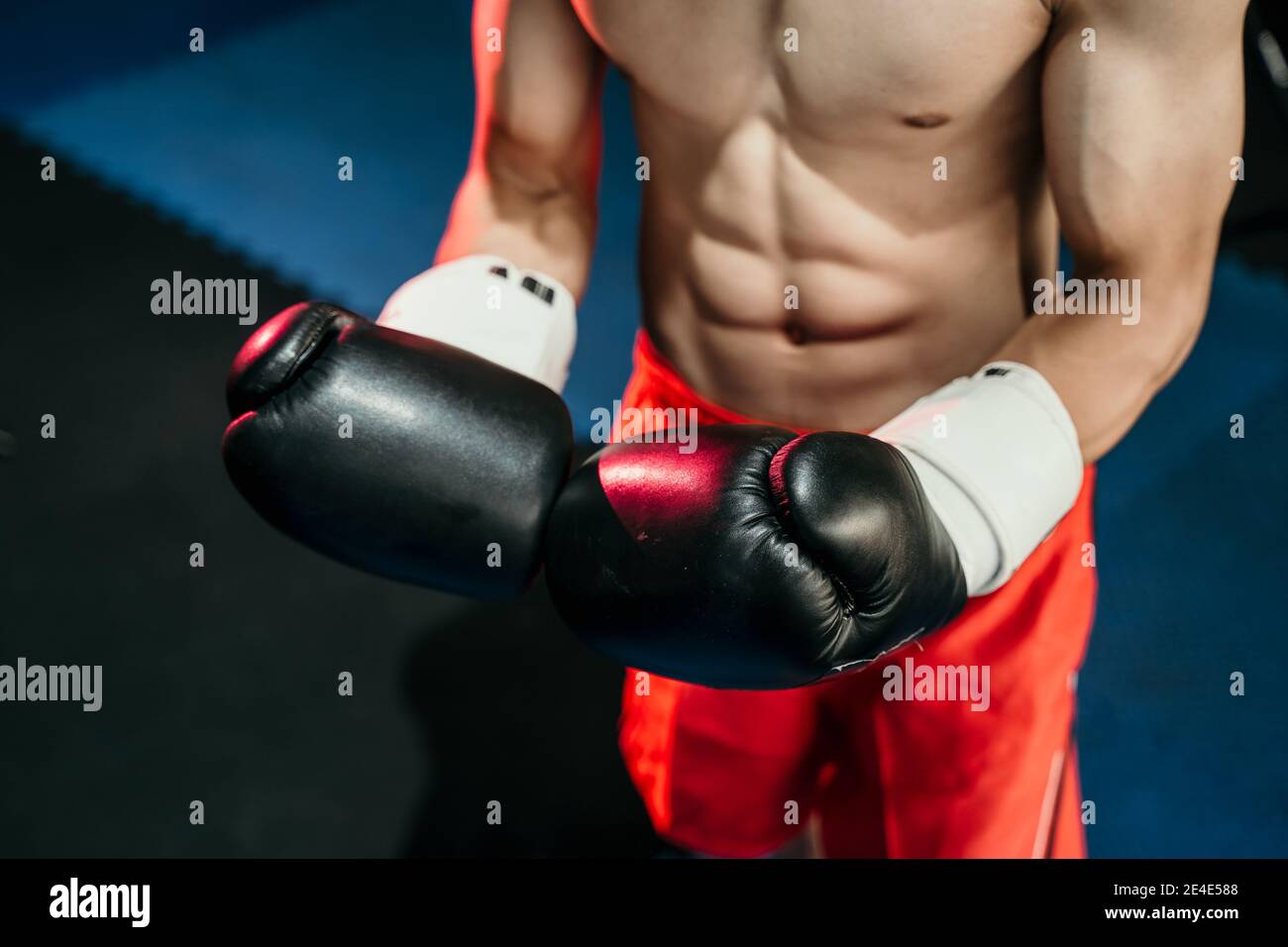 close up of boxer hand's in boxing gloves in the boxing ring background ...