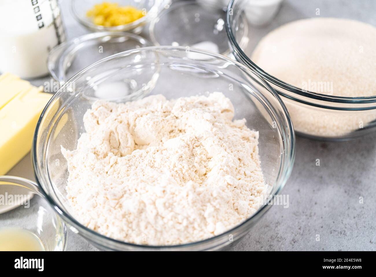 Ingredients in a glass mixing bowls to bake a lemon pound cake Stock ...