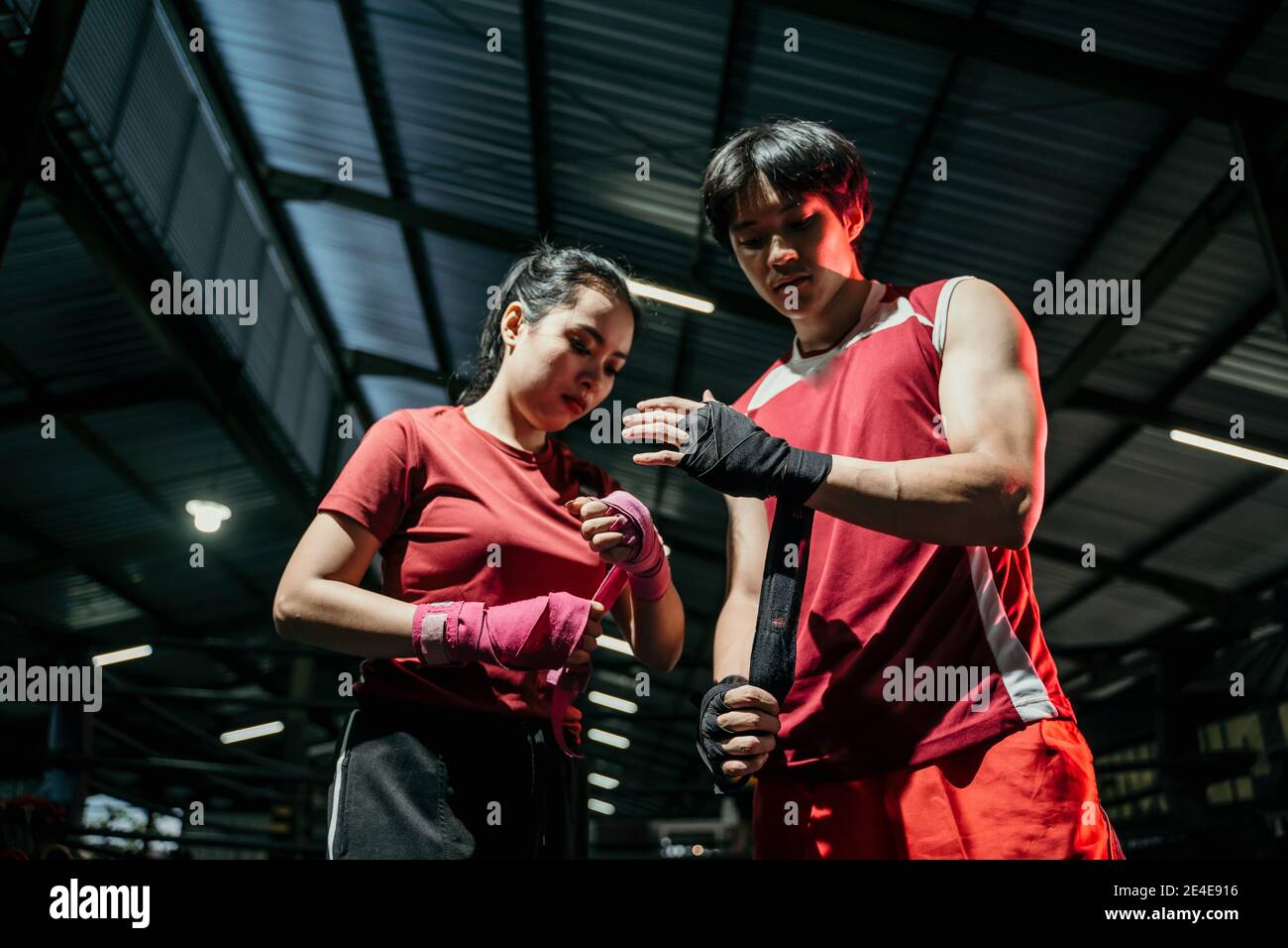 Fighting couple preparation. Cropped shot of a ripped asian male and ...