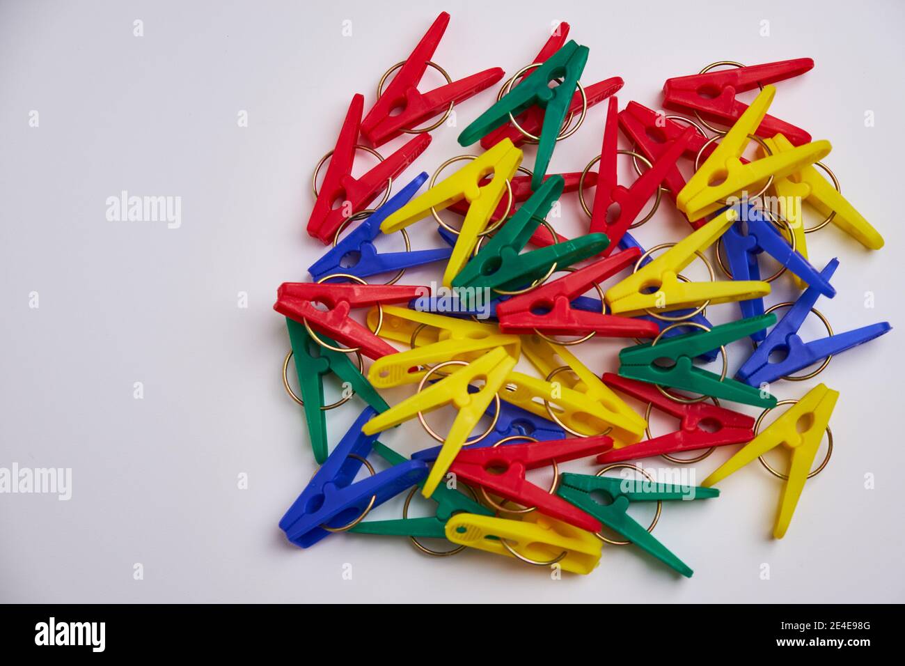 Multicolor laundry clips on white background, top view of colorful ...