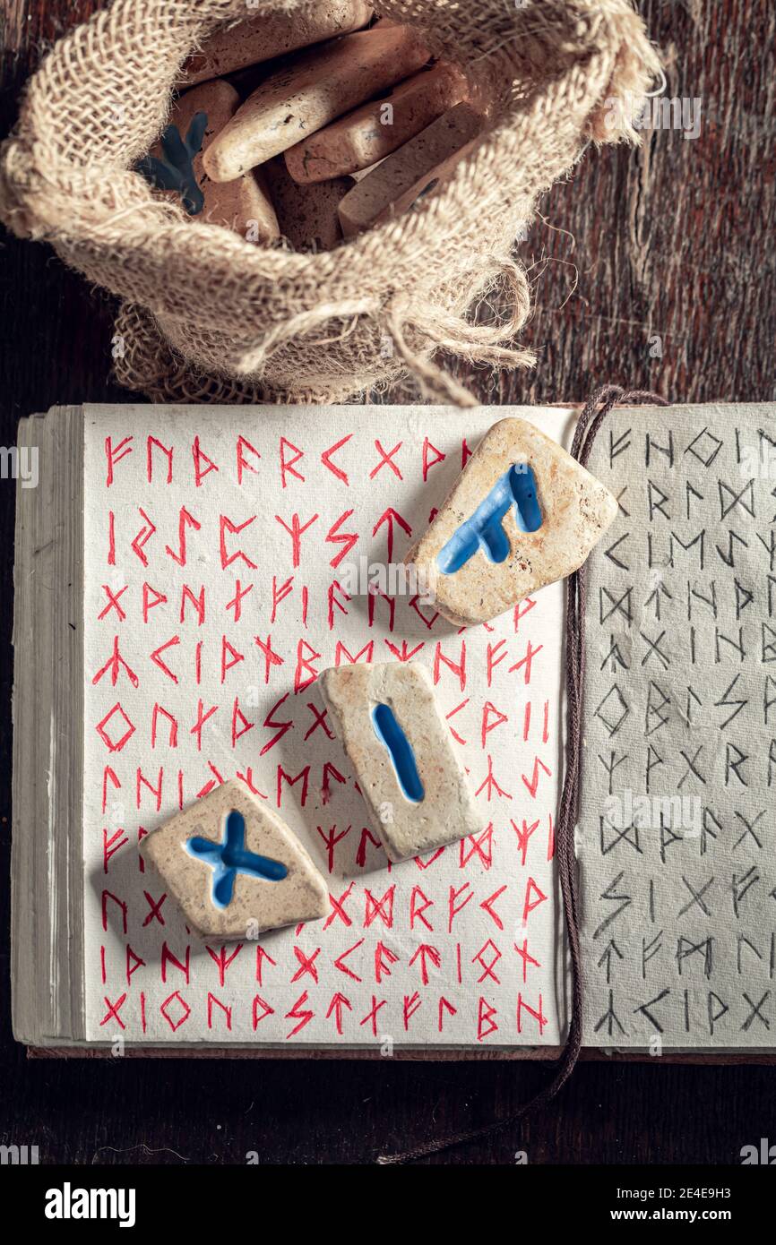 Original rune stones omen made of Celtic language on old table Stock ...