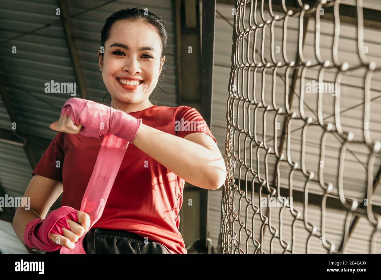 Ultimate asian woman fighter getting ready, smiling muscled asian woman ...