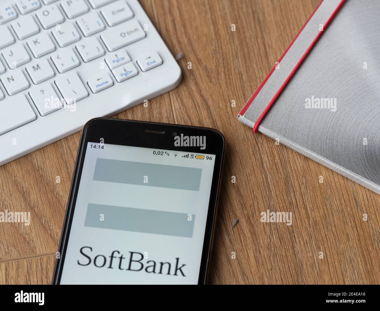 In this photo illustration a SoftBank logo seen displayed on smartphone ...