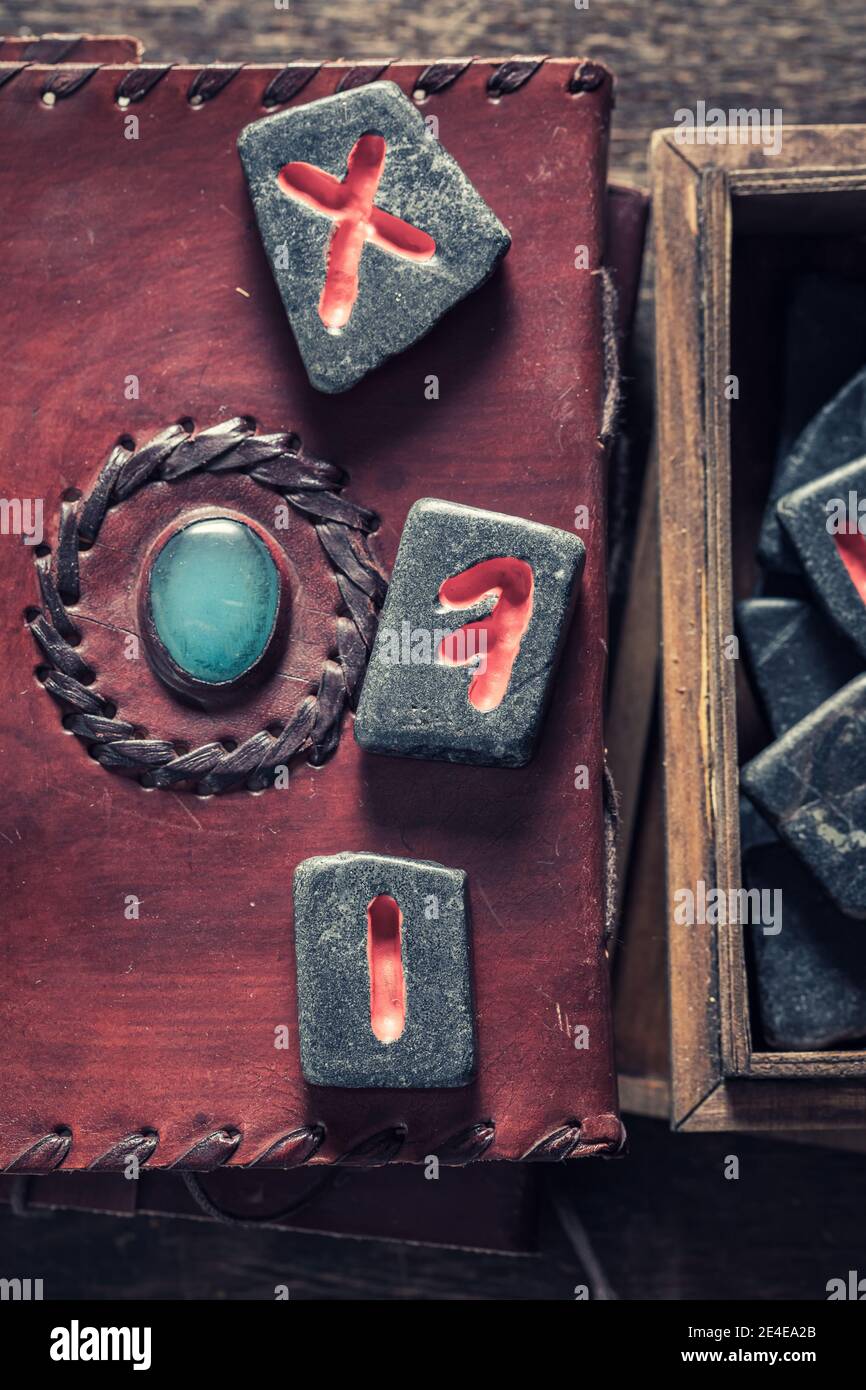 Vintage rune stones using old Celtic language and leather book Stock ...