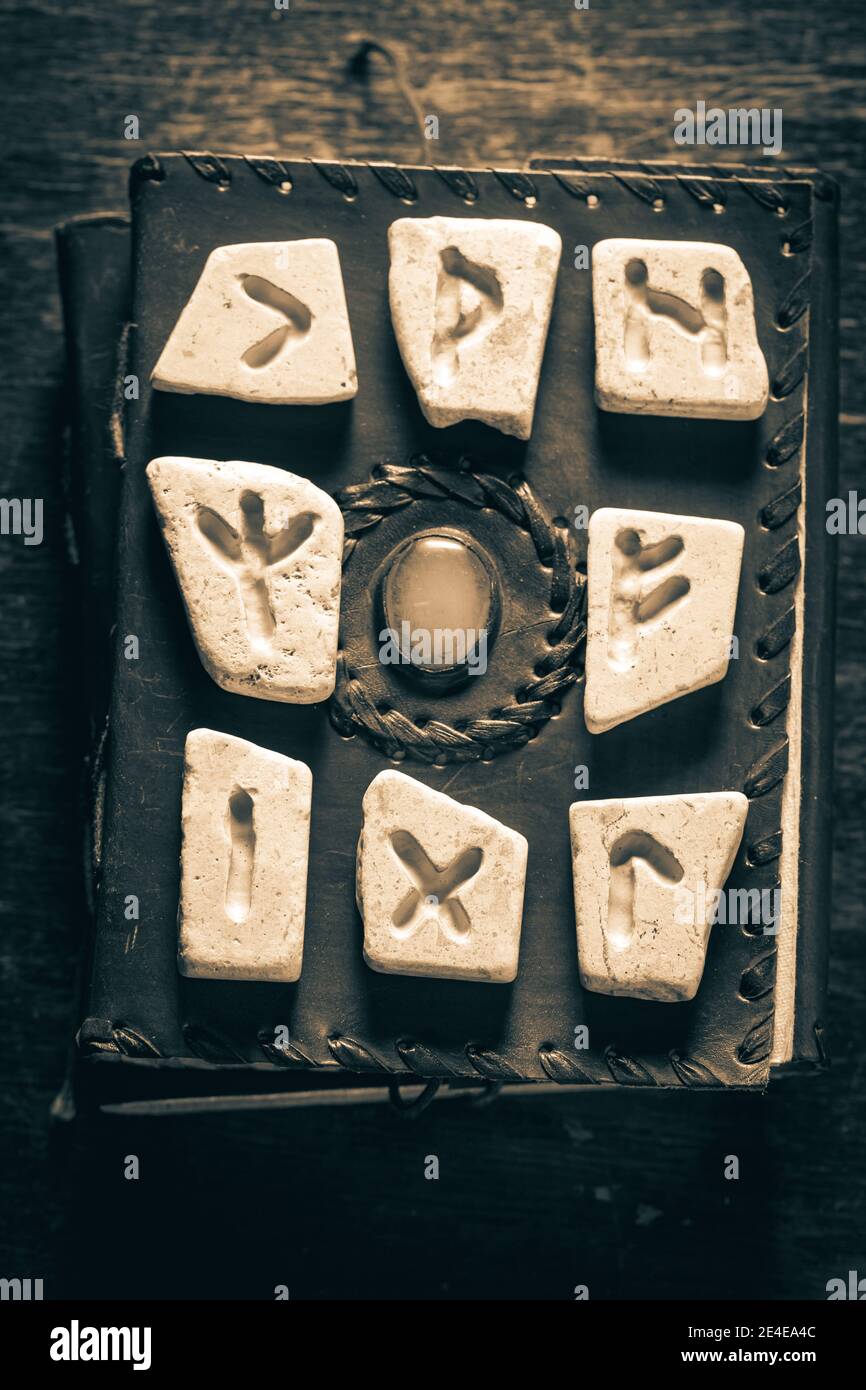Unique divination by rune stones using Celtic language on old book ...