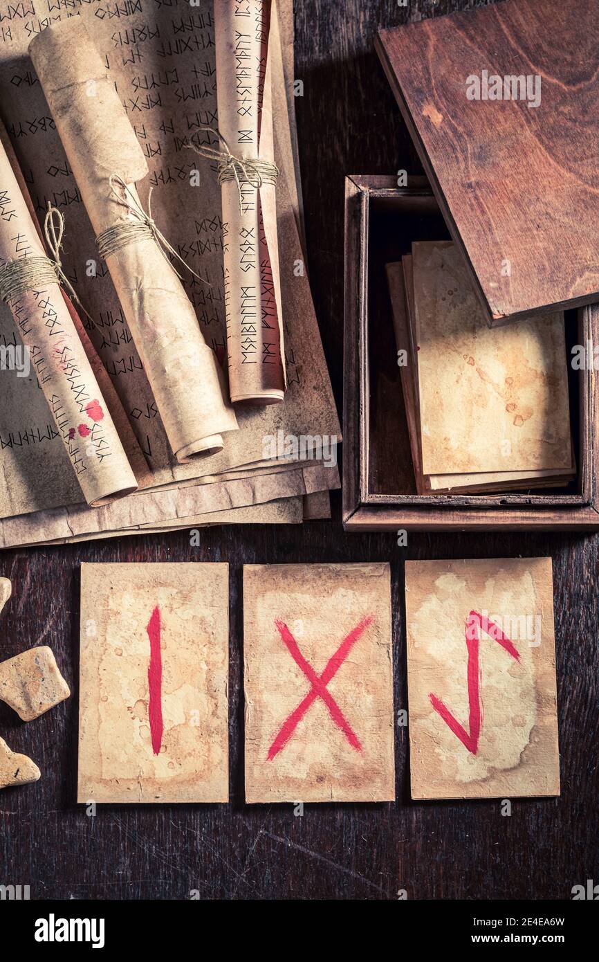 Fortune teller from futhark rune cards based on old scrolls on wooden ...