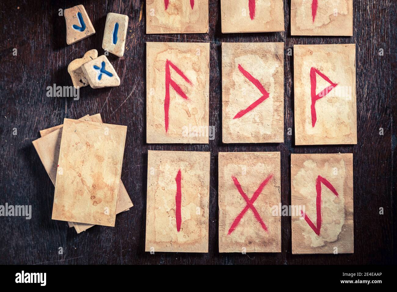 Top view of fortune teller from futhark rune cards on wooden table ...