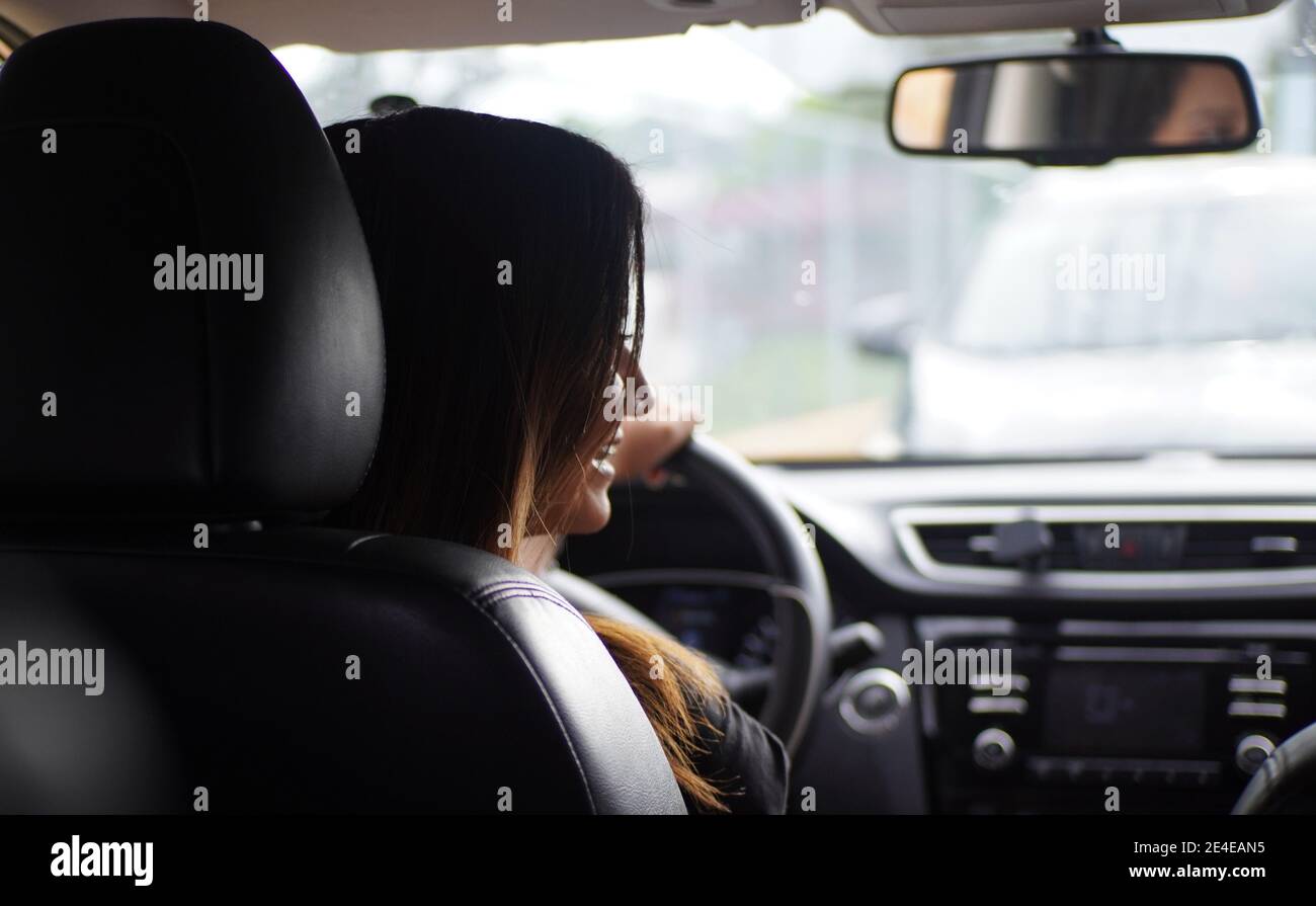 Hispanic female driving a car Stock Photo - Alamy
