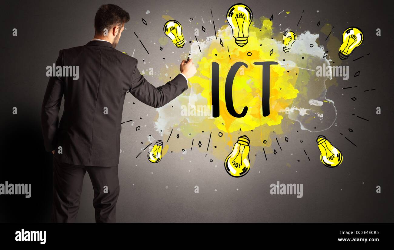 businessman drawing colorful light bulb with ICT abbreviation, new ...