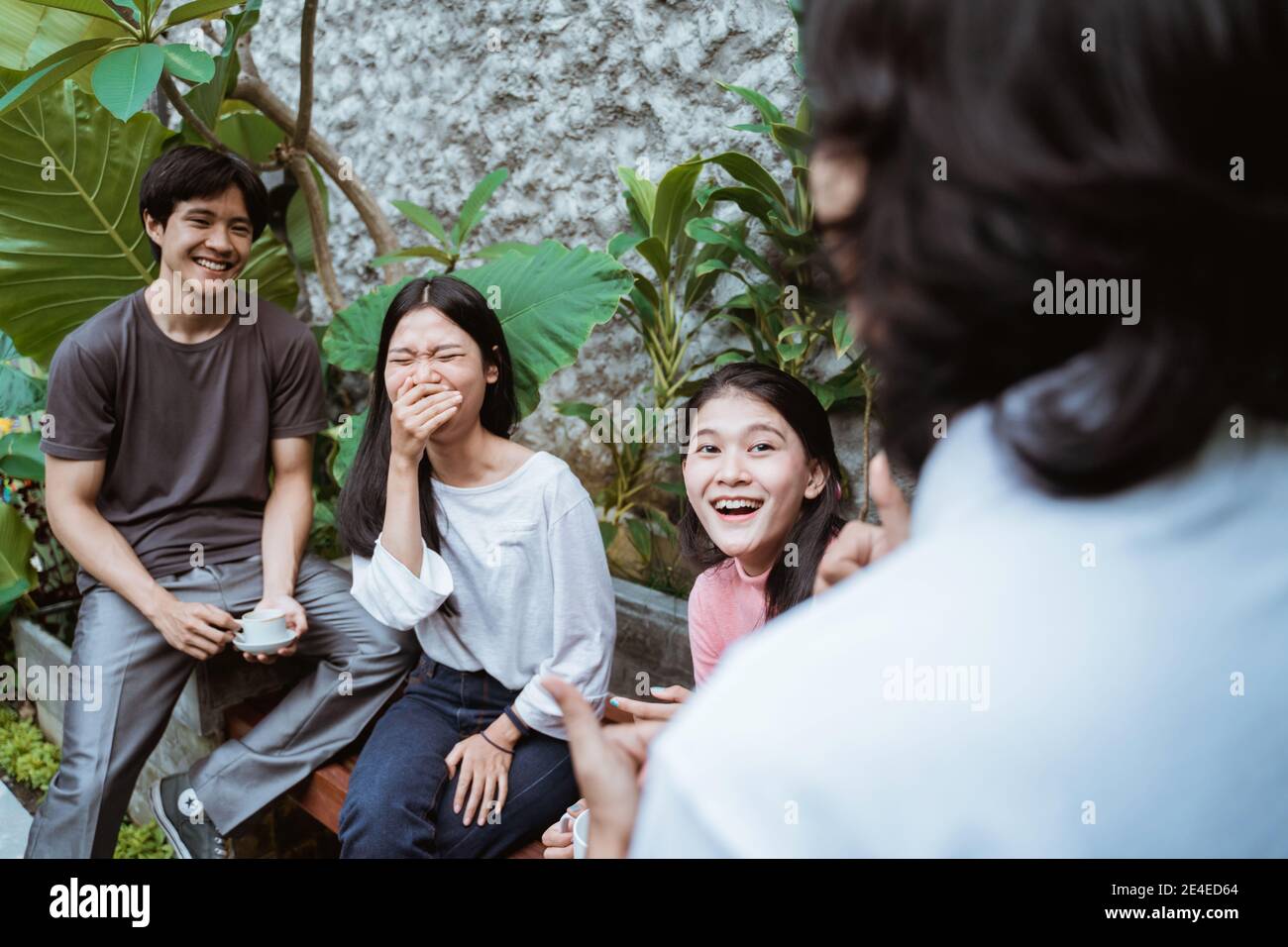 Friends having fun enjoying time together in a cafe Stock Photo - Alamy