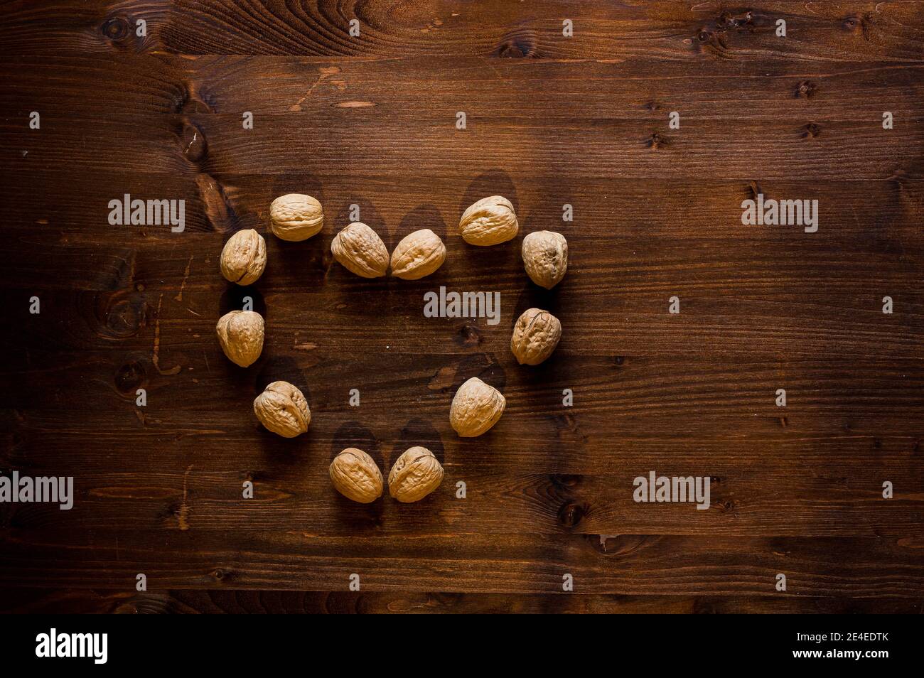shaped nuts compositions on wooden background for natural feeling Stock ...