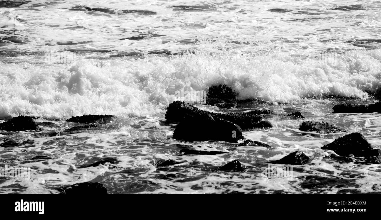 Beautiful waves splashing on rock Stock Photo - Alamy