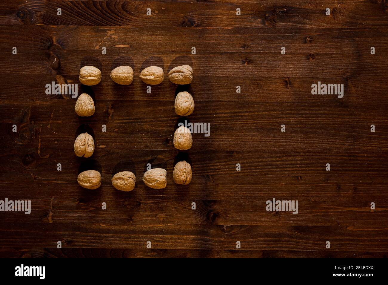 shaped nuts compositions on wooden background for natural feeling Stock ...