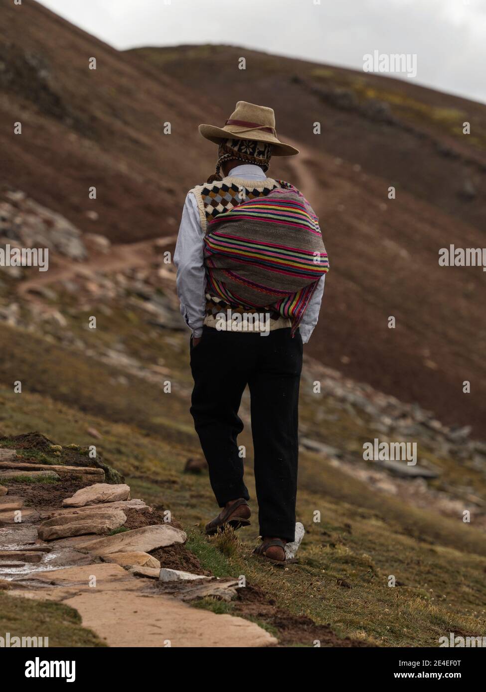 Peruvian man in traditional andean indigenous clothes at Cordillera de ...