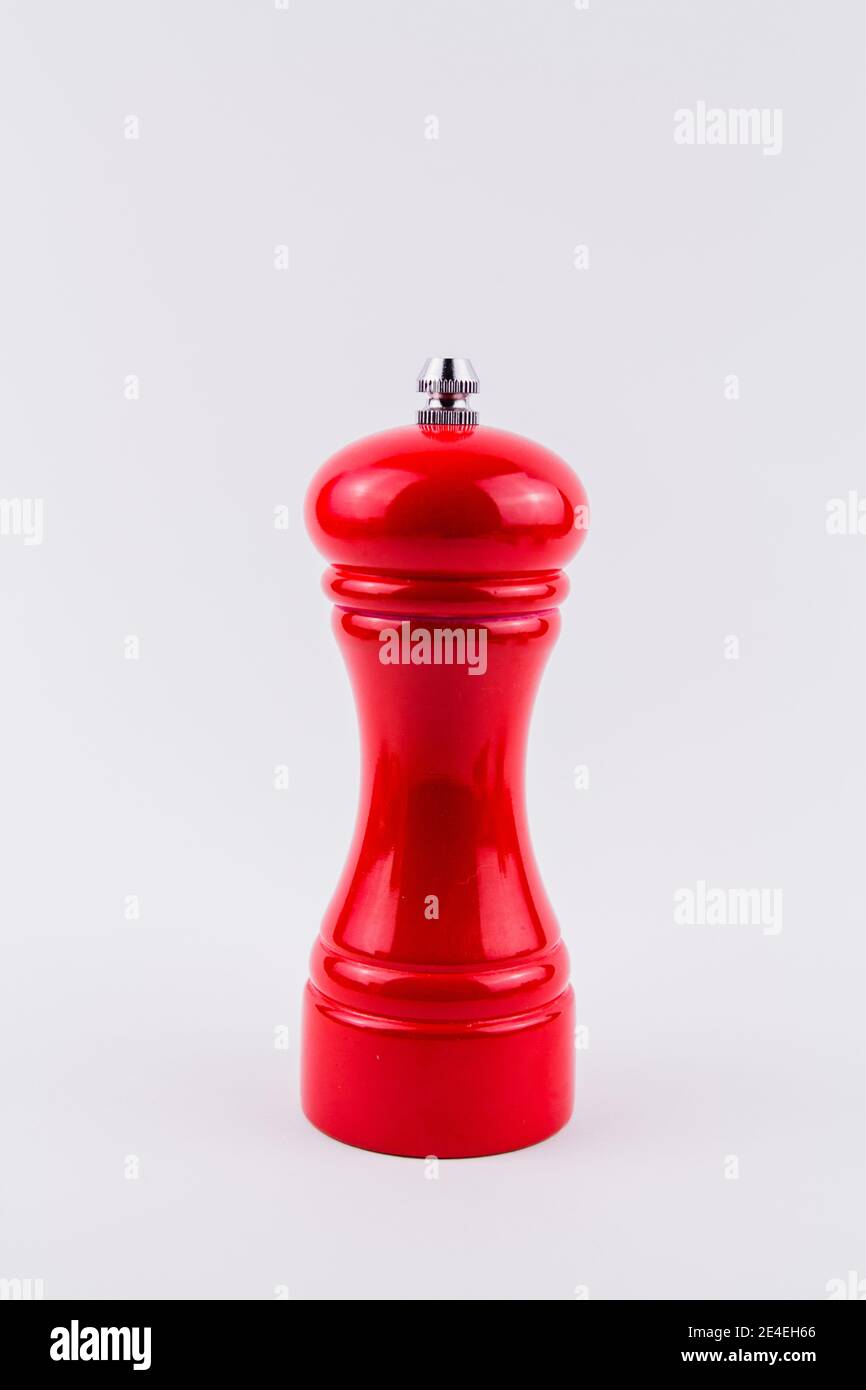 a red pepper shaker on white background Stock Photo - Alamy