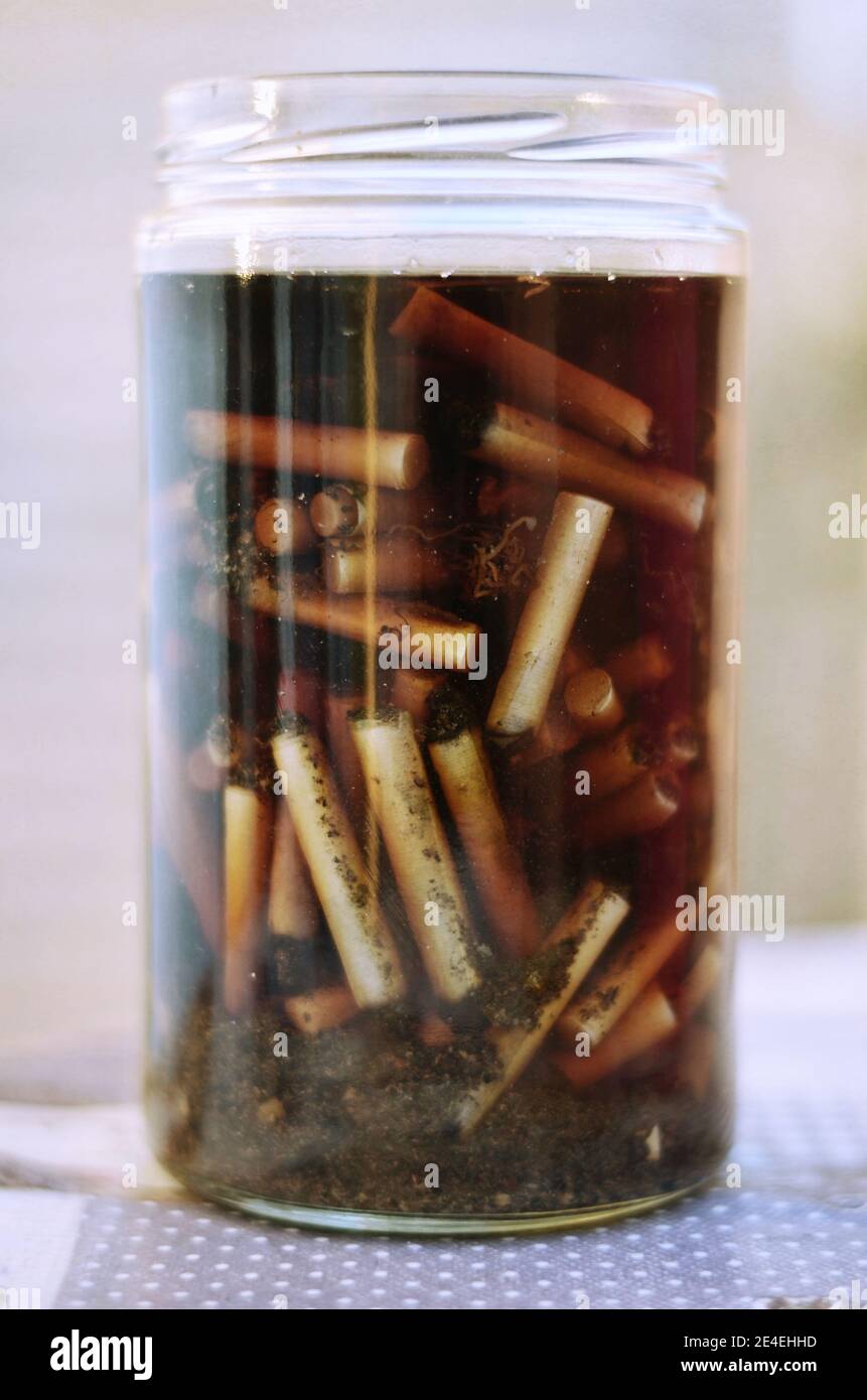 Cigarettes in water Stock Photo - Alamy