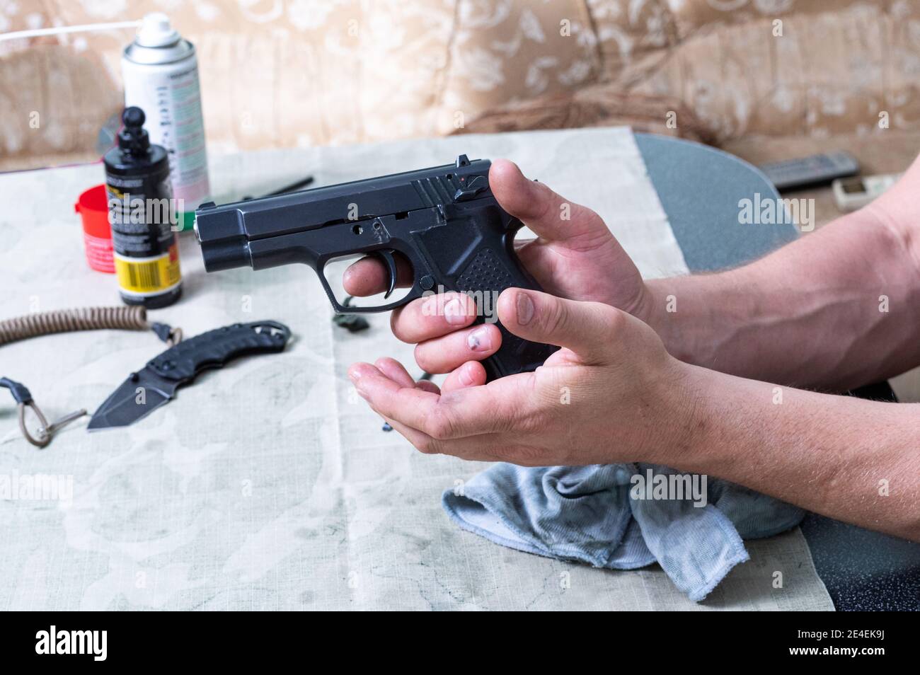 Insert cartridges into the pistol. Insert the magazine with cartridges ...