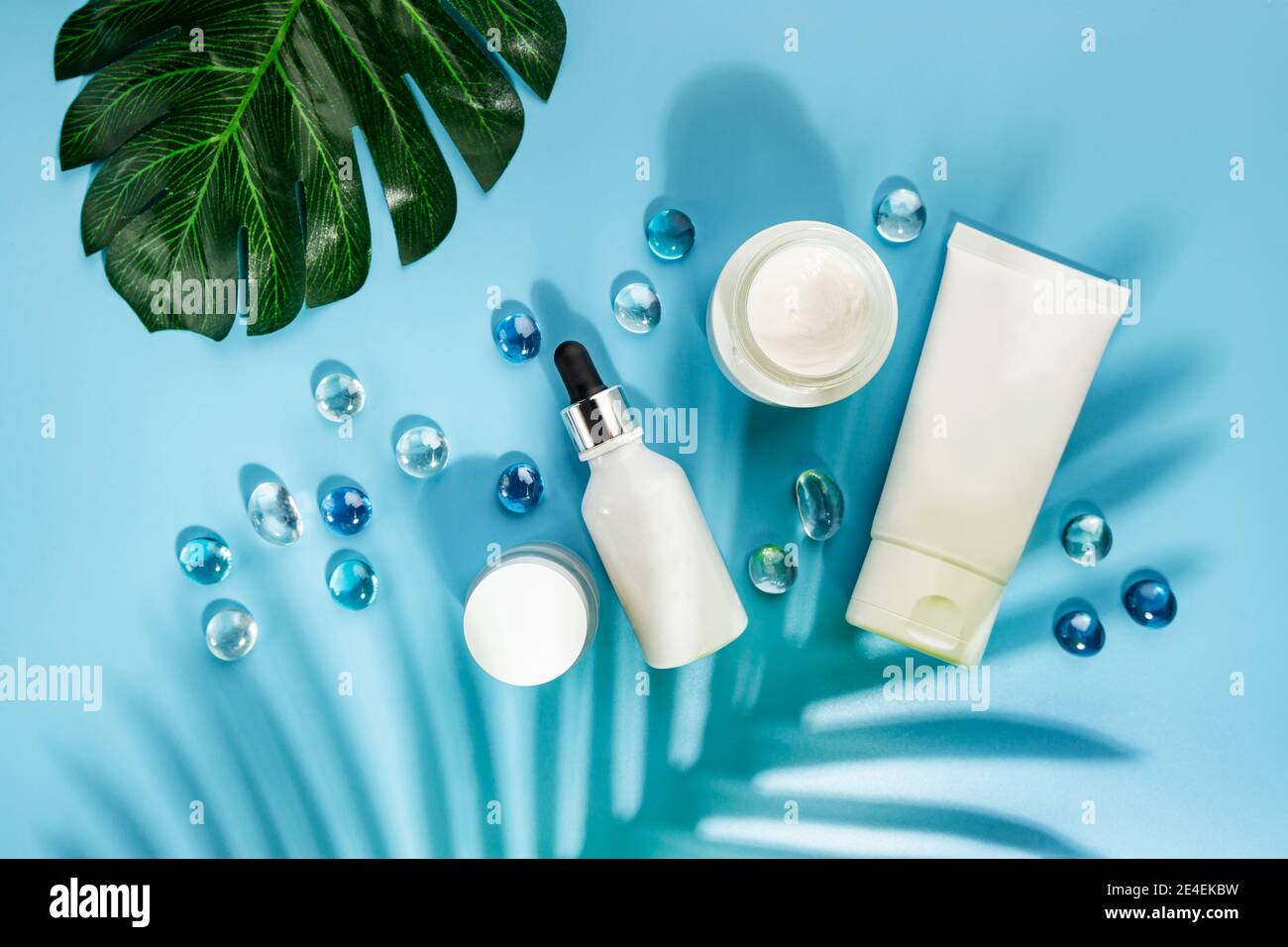 Flat lay composition with skin care products on blue background Stock ...