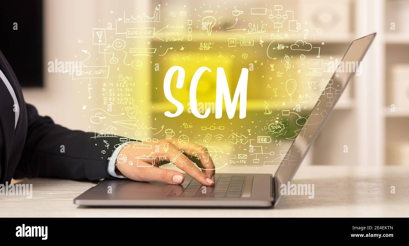 hand working on new modern computer with SCM abbreviation, modern ...