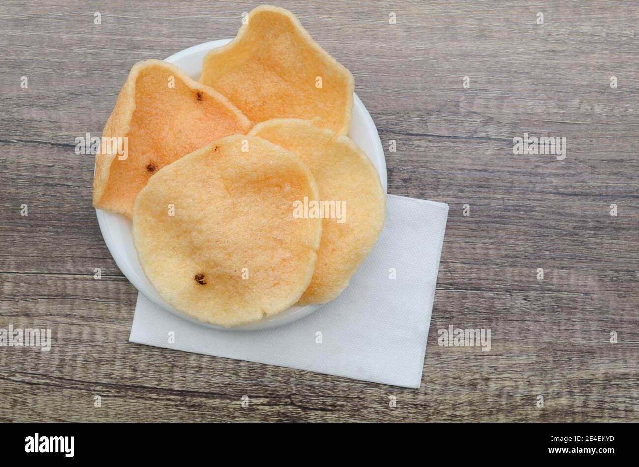 Shrimp rice crackers on plate meal Stock Photo - Alamy