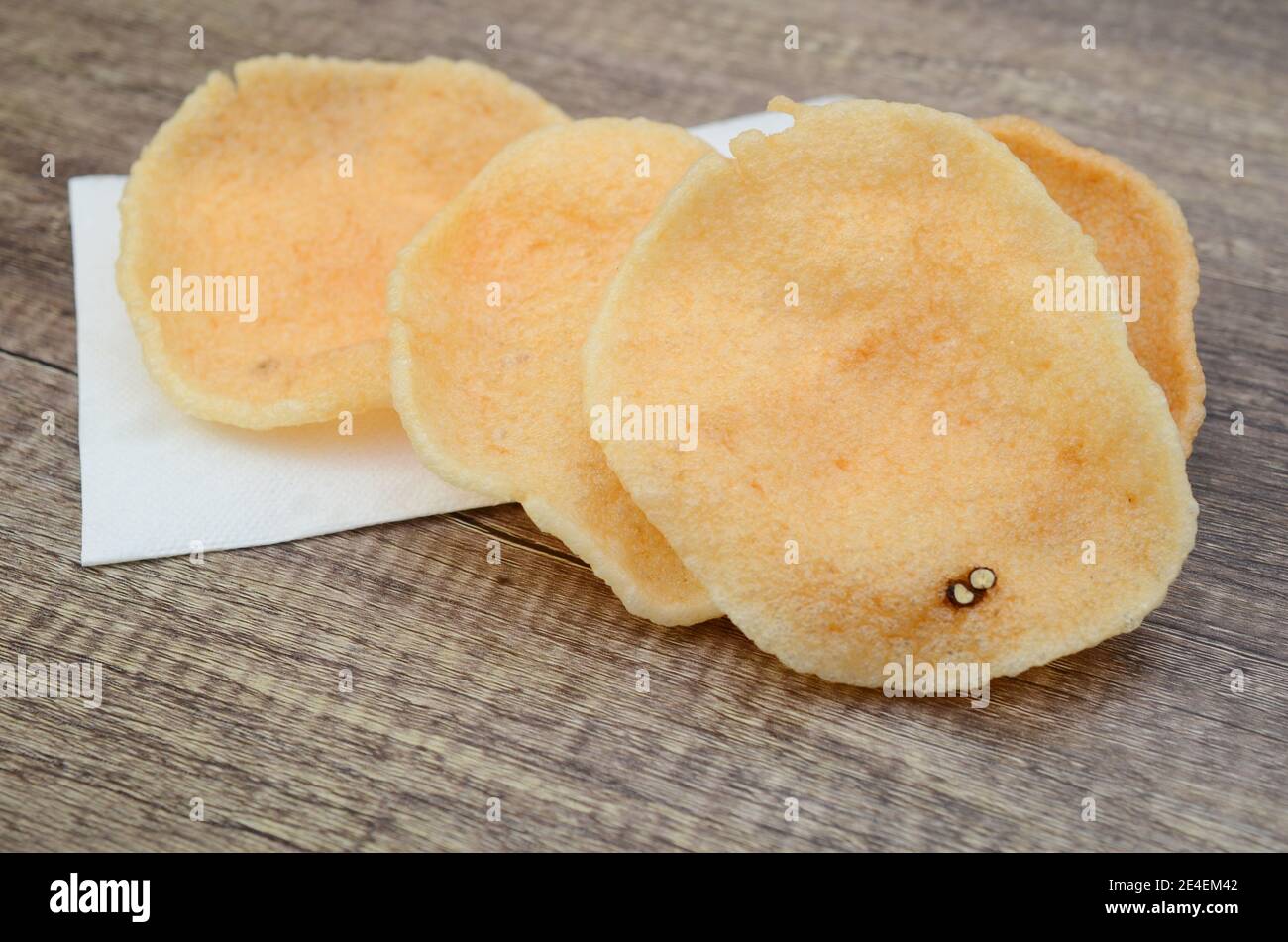 Shrimp rice crackers on white napkin paper Stock Photo - Alamy