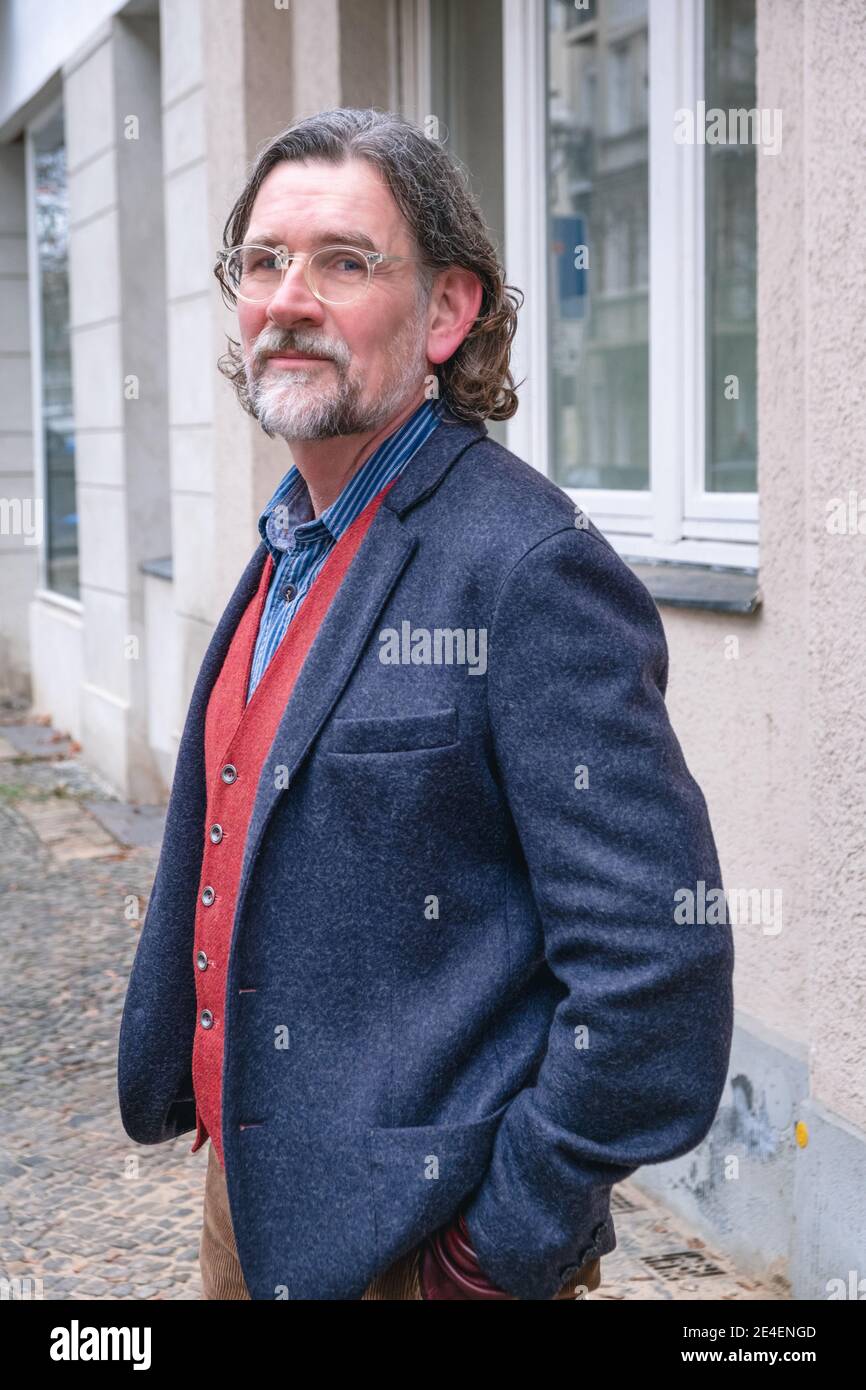 portrait of handsome man in his 50s standing in front of building Stock ...