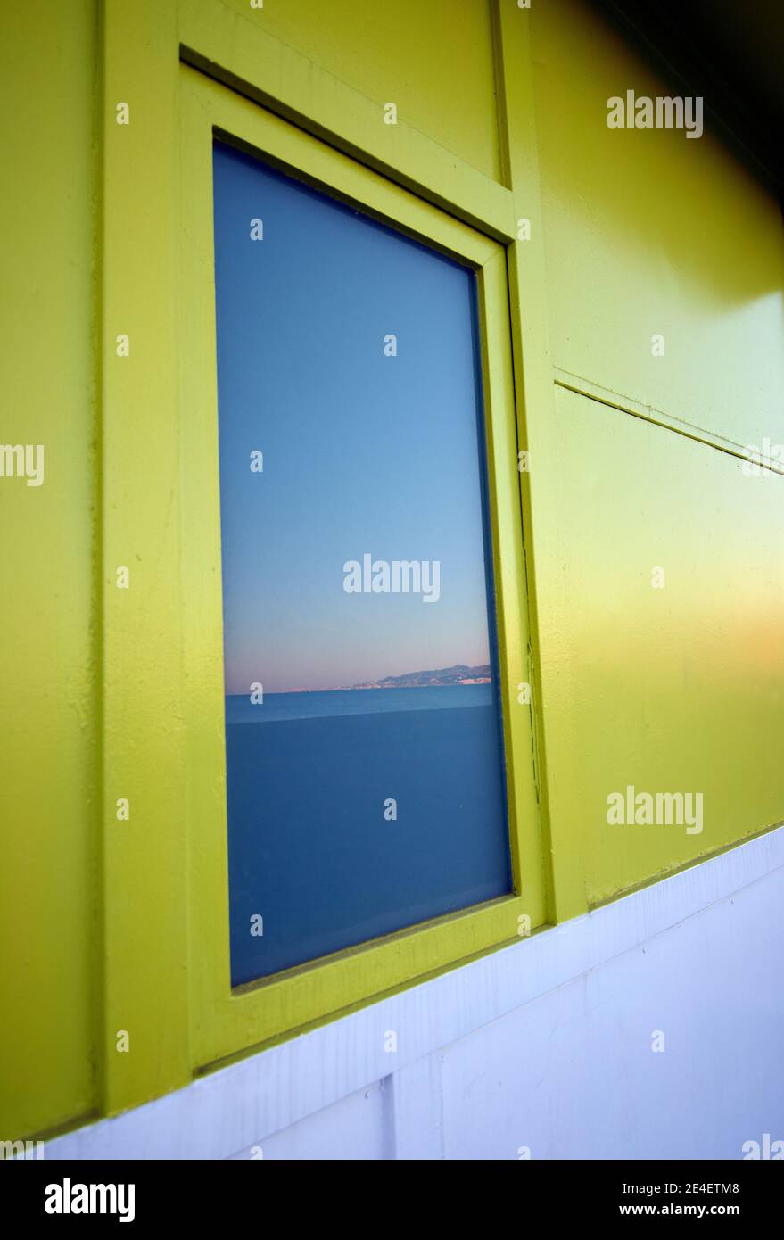 Reflection of the sunset scenery in a window Stock Photo - Alamy