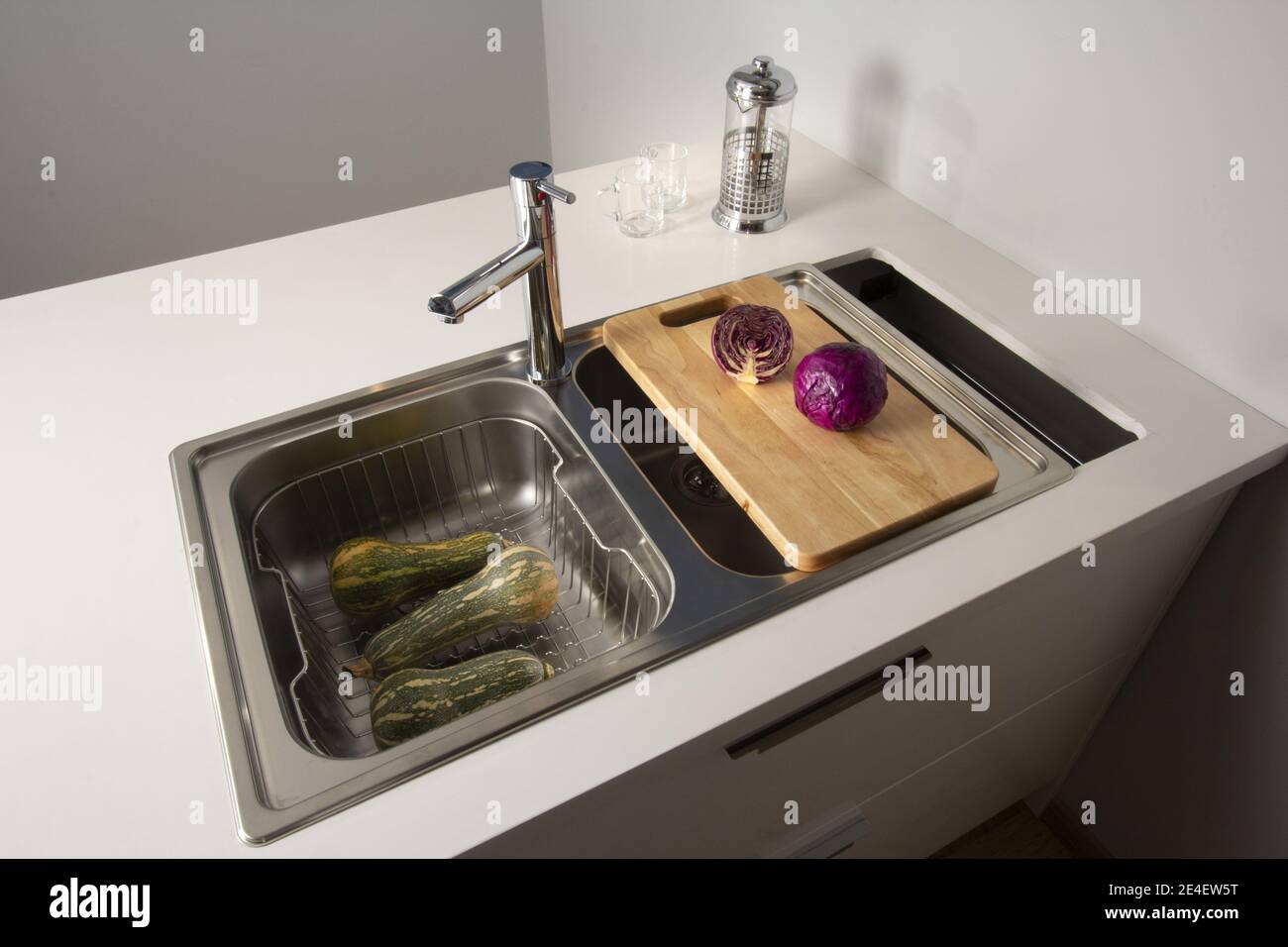 High angle shot of a kitchen sink with squash and a cutting b Stock ...