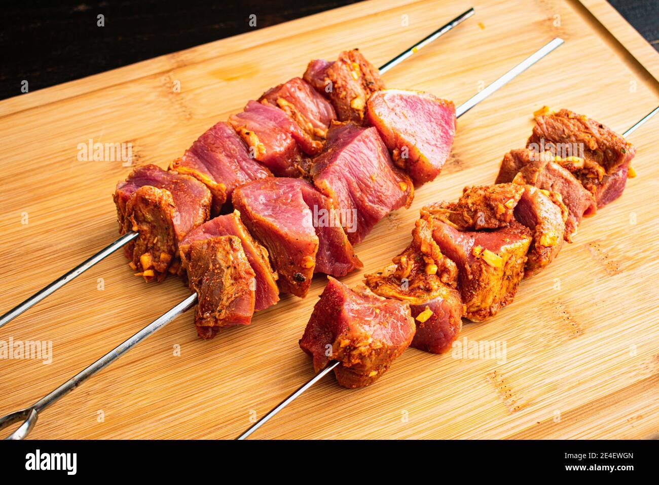 Raw Pinchos Morunos - Spanish Pork Kebabs: Uncooked chunks of marinated ...