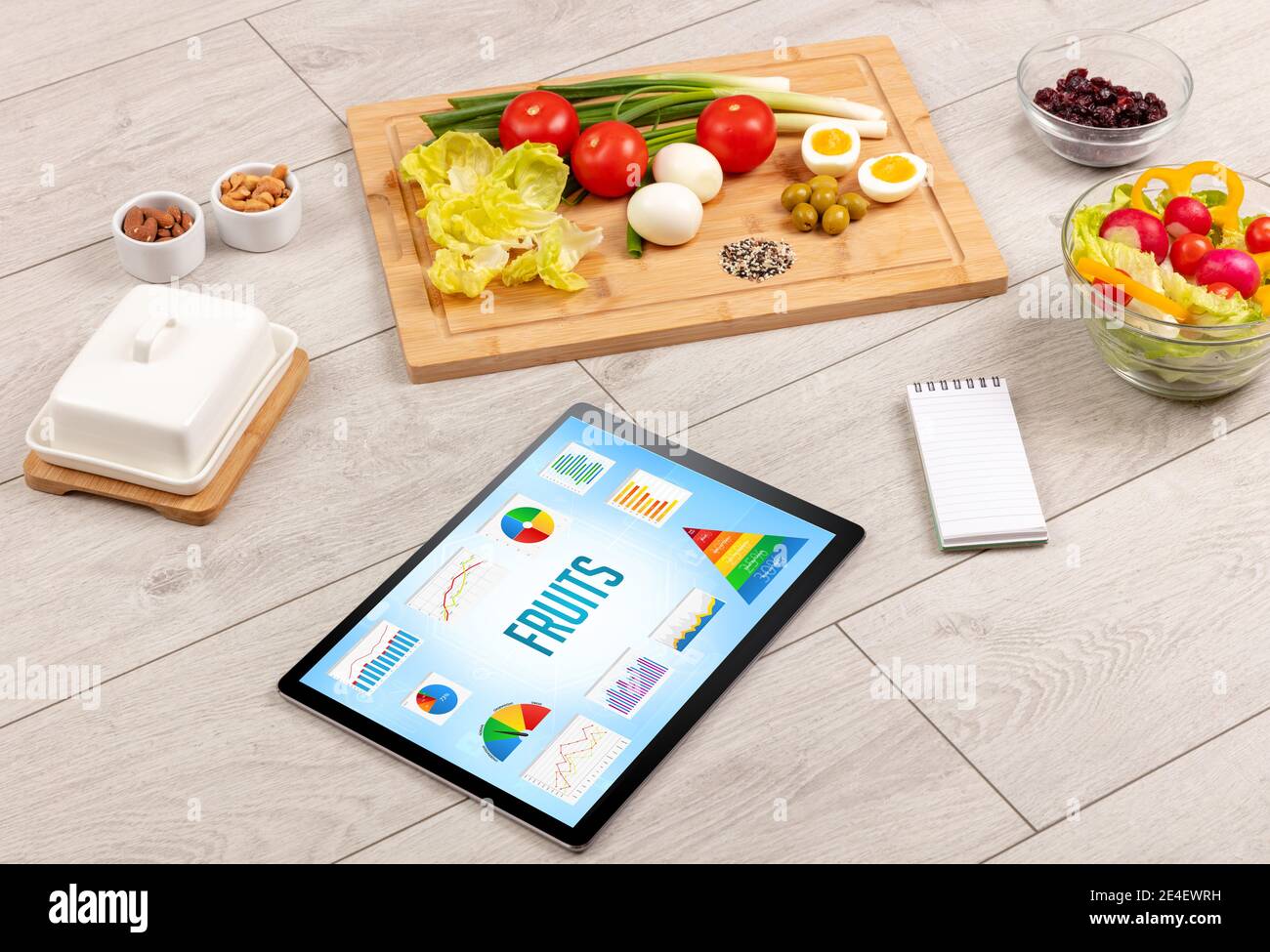 Organic food and tablet pc showing FRUITS inscription, healthy ...