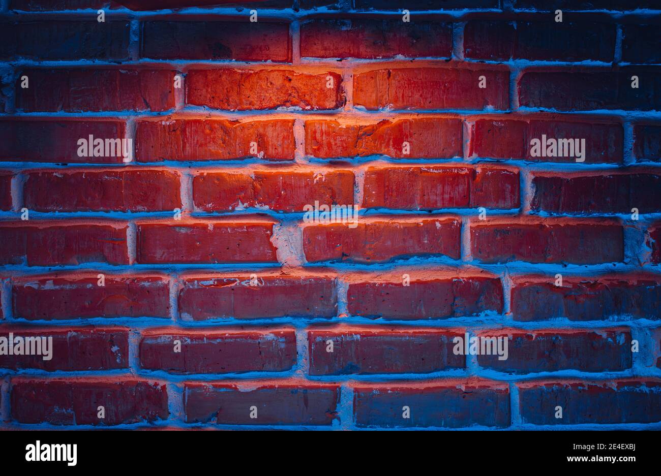 Brick wall texture background in red and blue neon lights Stock Photo ...