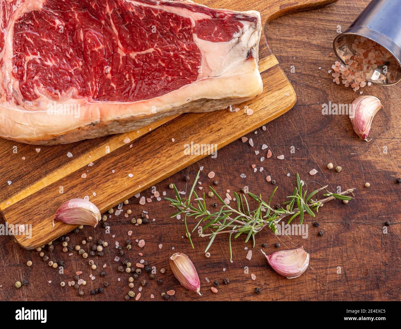 Fresh raw sashi beef steak with rosemary, himalayan salt, garlic and ...