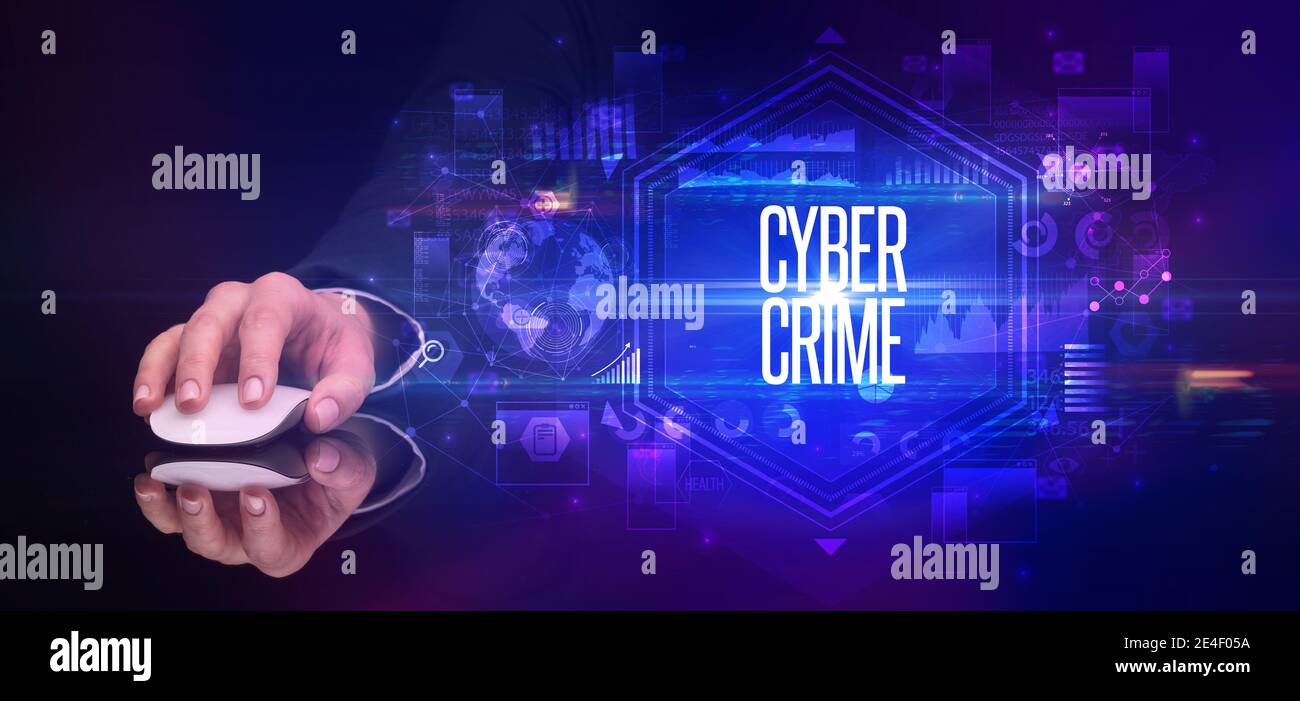 hand holding wireless peripheral with CYBER CRIME inscription, cyber ...