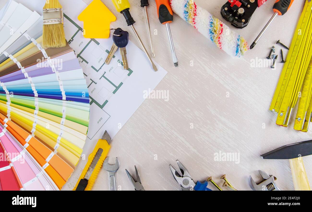 home improvement and renovation concept - construction tools and items ...
