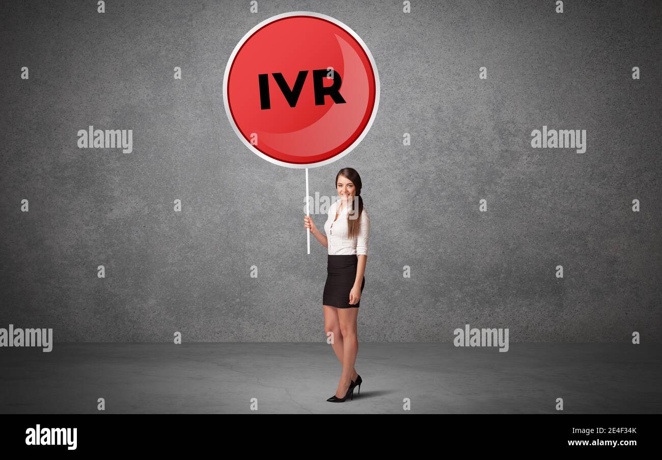 Young business person holdig traffic sign with IVR abbreviation ...