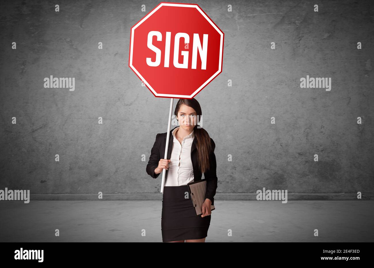 Young business person holding road sign with SIGN inscription, new ...