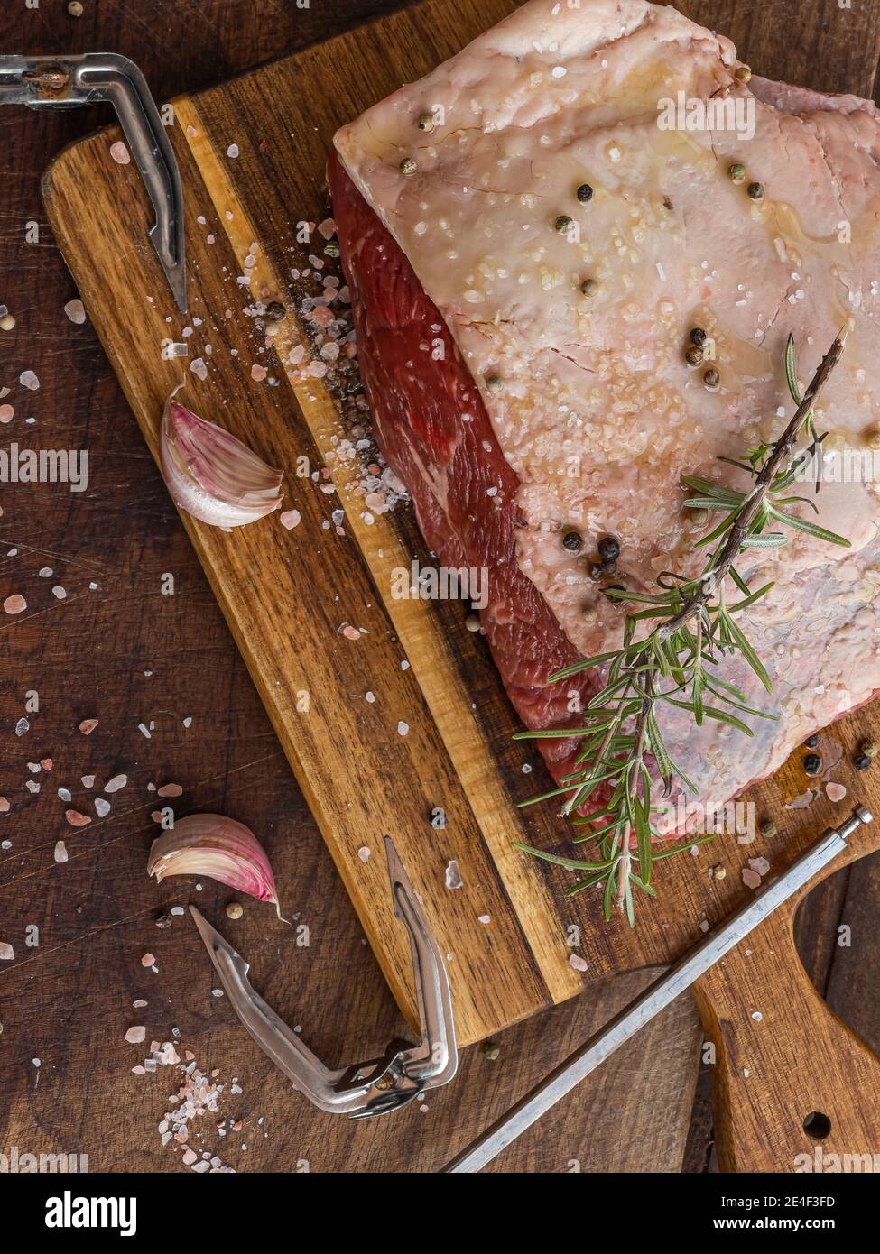 Raw picanha with himalayan salt, black pepper, garlic, rosemery and ...
