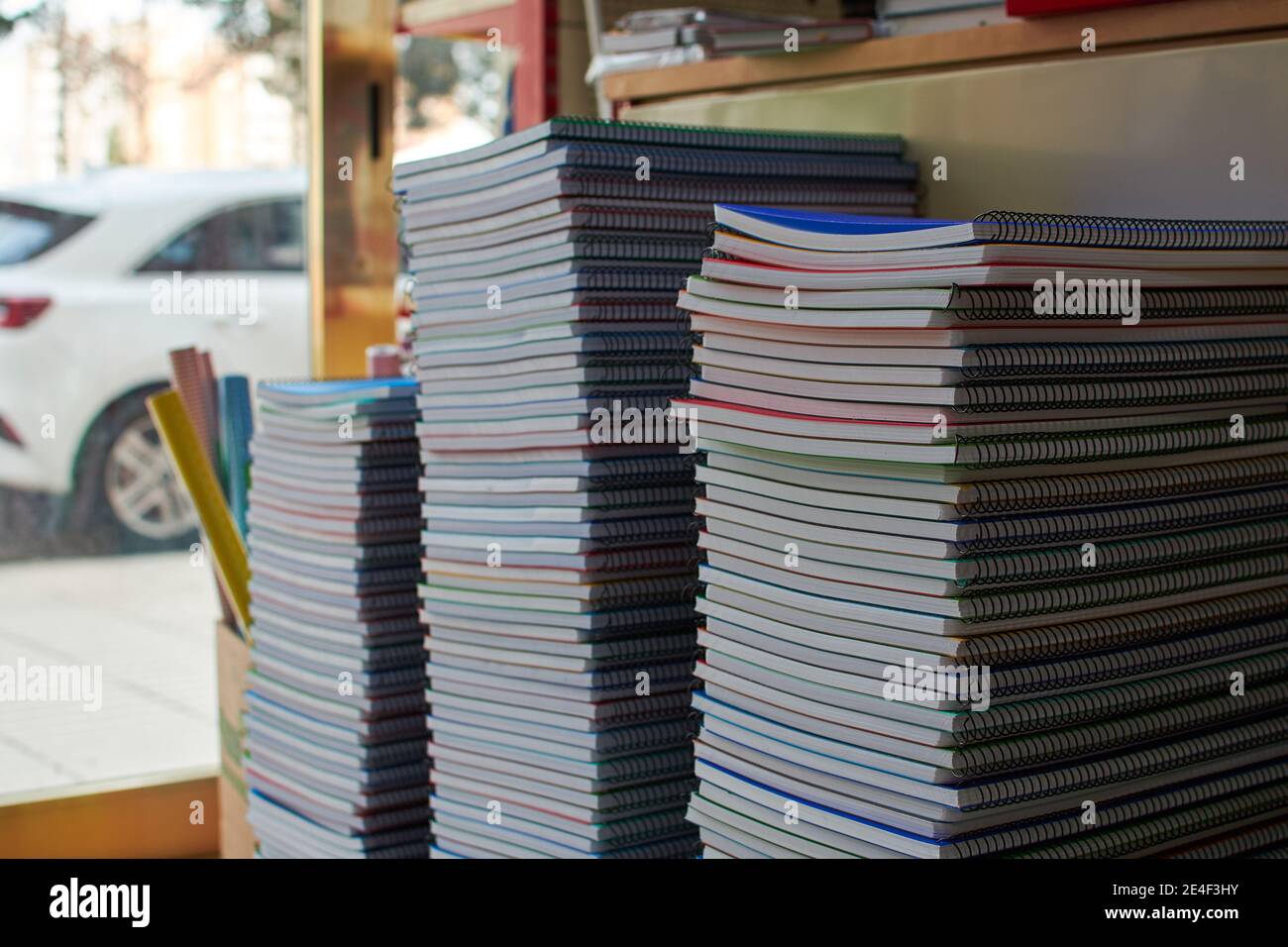Lines of folded school notebooks in the stationery store Stock Photo ...
