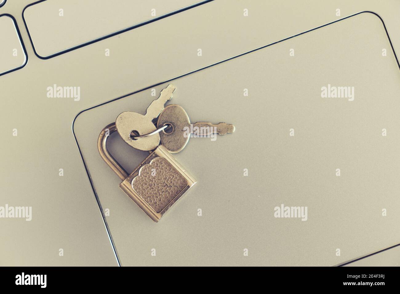 Padlock and keys on a laptop touchpad. Computer security concept. Copy ...