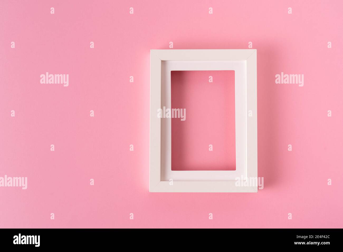 Minimalistic style. Picture frame on pink paper background Stock Photo ...