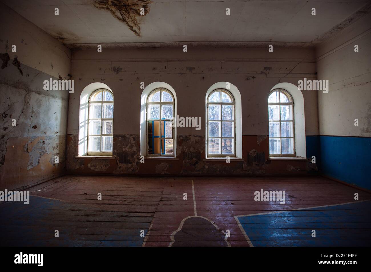 Large empty hall inside old abandoned building Stock Photo - Alamy