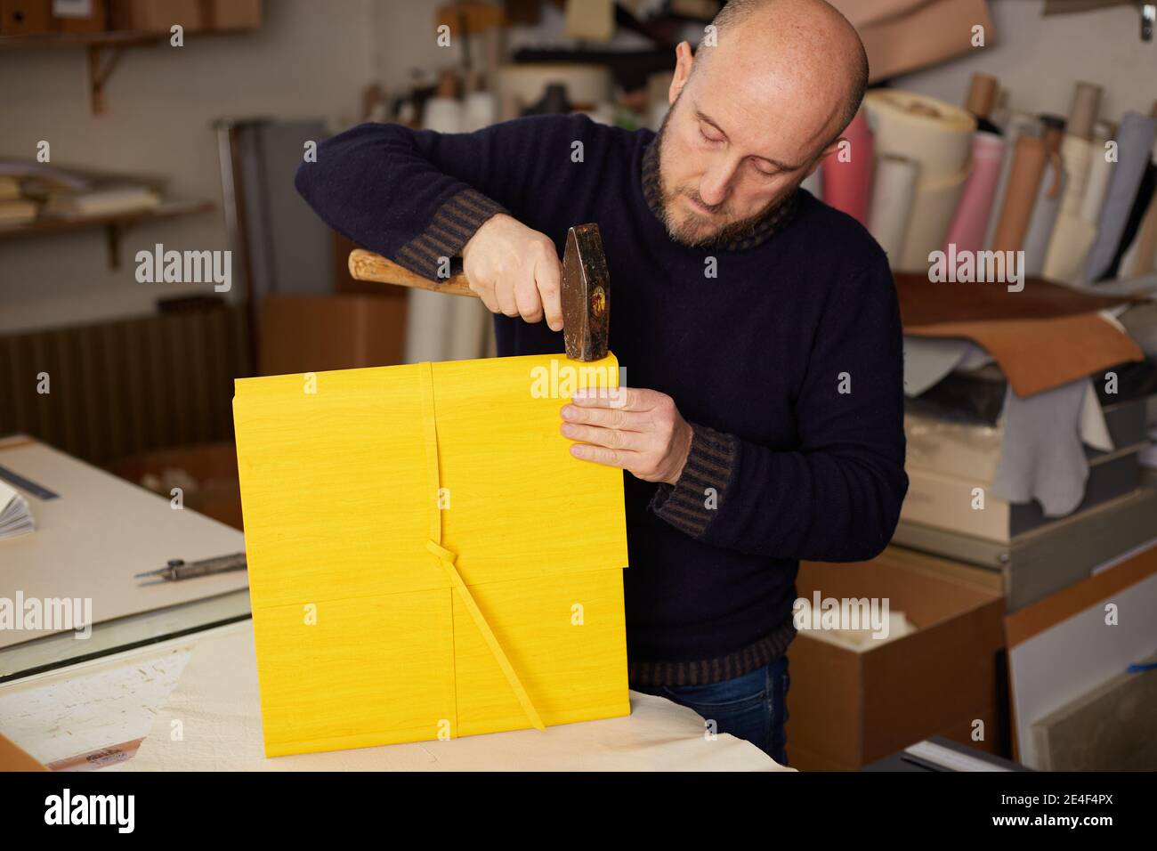 book binder working in a warehouse Stock Photo - Alamy