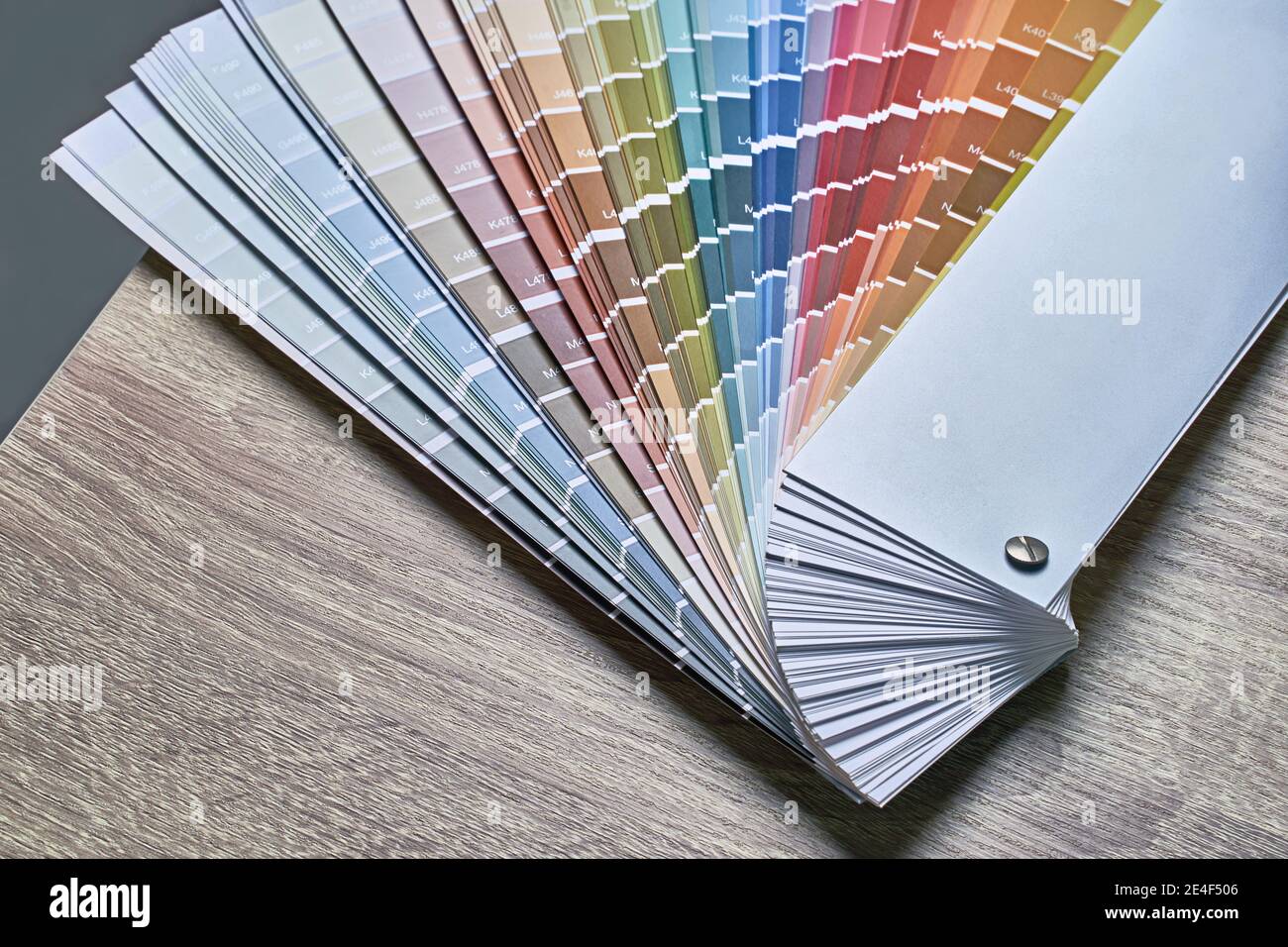 Color wheel palette for choosing paint tone. Various colors on wooden ...
