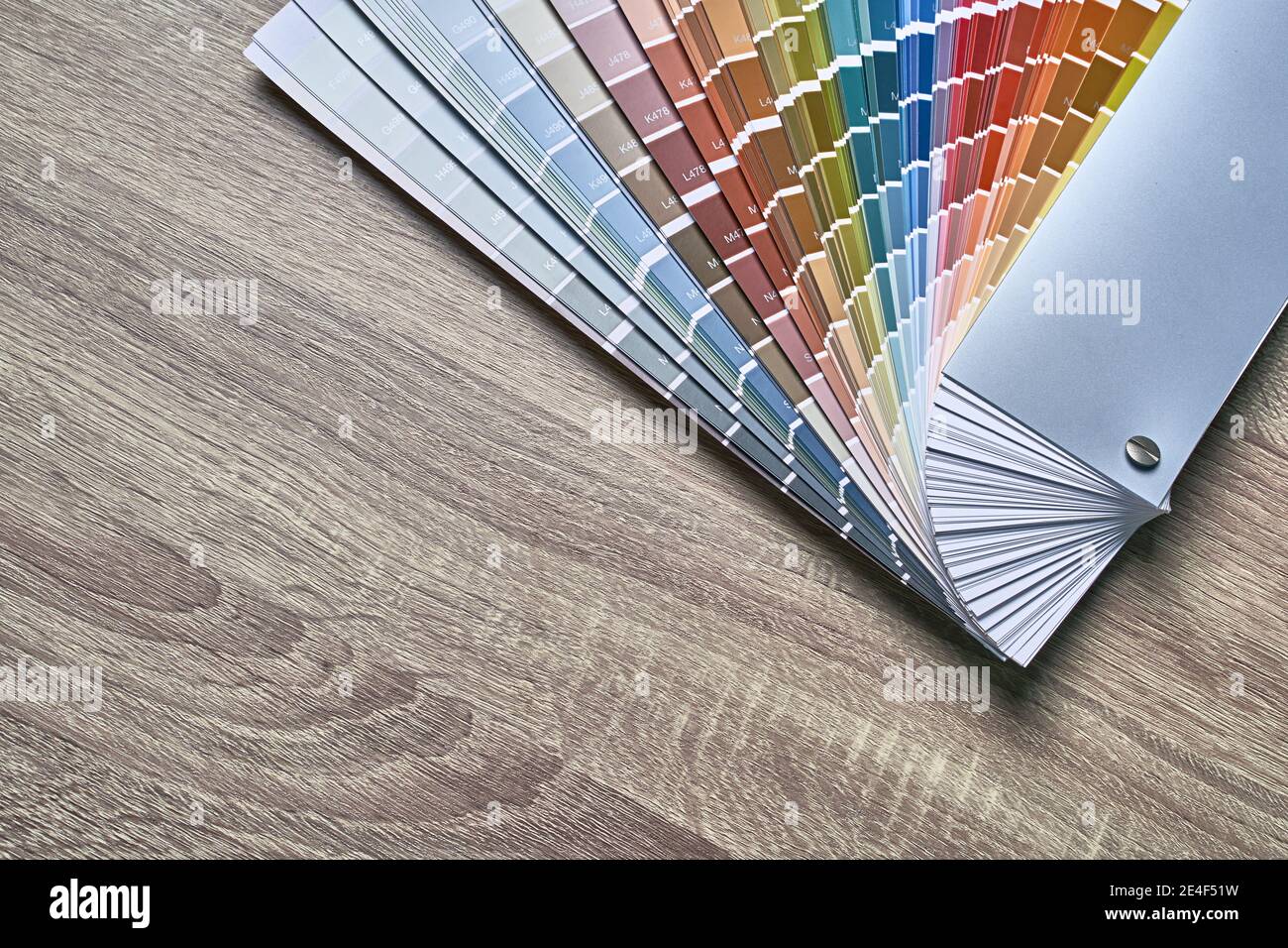 Color wheel palette for choosing paint tone. Various colors on wooden ...