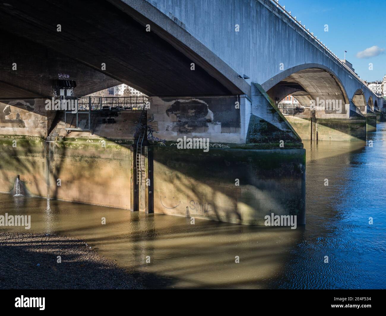 Waterloo Bridge in London covered by light and shade Stock Photo - Alamy