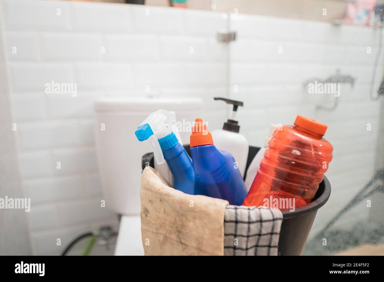 cleaning tools in the bucket. bottle sprayer, cleaning liquid bottle ...