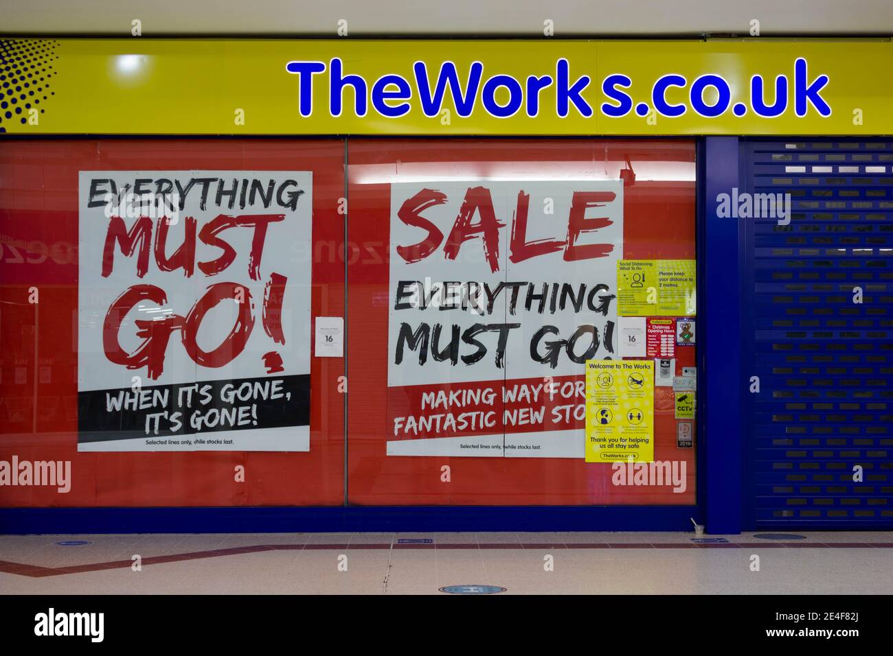 Everything must go sale poster on shop window of the works.co.uk Stock ...